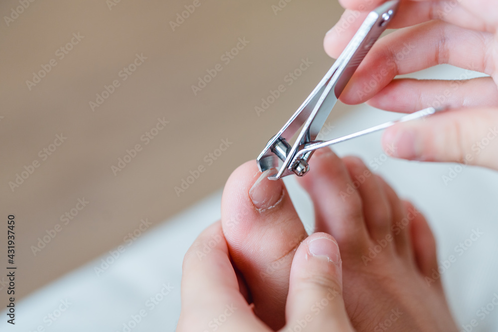 clean nails.kid child girl cutting nails using stainless steel nail ...