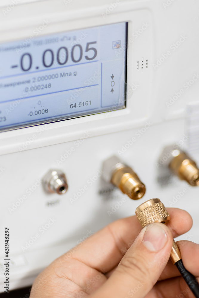 The metrology and standardization laboratory specialist connects the ...