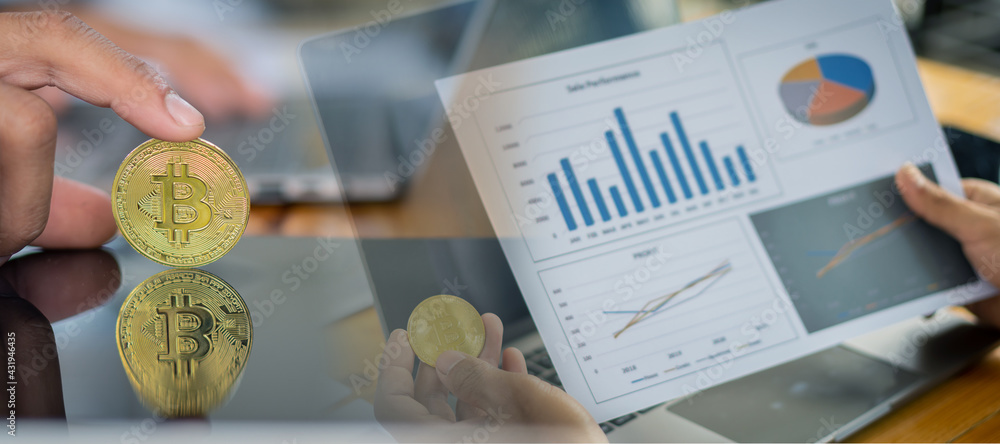 Bitcoin traders who are analyzing graphs that are rising and falling ...