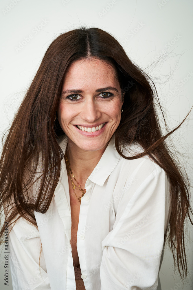 Happy beautiful woman with long brown hair on white background Stock ...