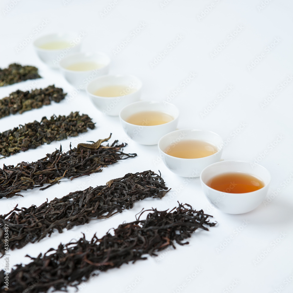 variety types of tea in little cups and natural tea leaves. Stock Photo ...