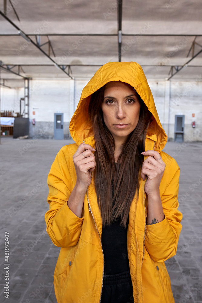 Beautiful female dancer in yellow jacket at abandoned factory Stock ...