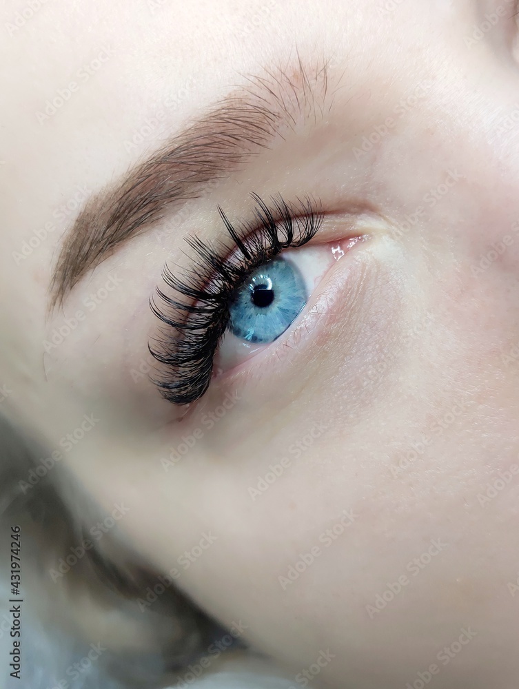 Lash extensions in beauty salon macro eye top view Stock Photo | Adobe ...