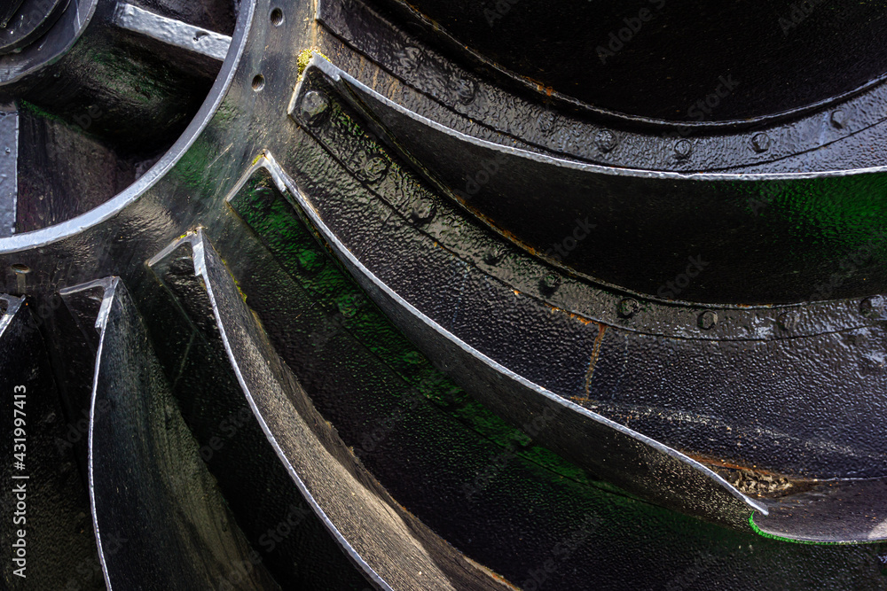 Photo & Art Print .Old riveted mine fan. Front view of the impeller and ...