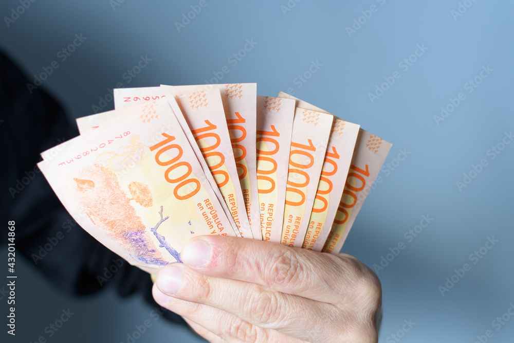 Hand holding thousand banknotes on white background Stock Photo | Adobe ...