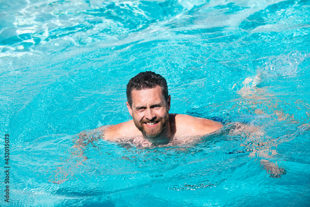 Handsome man in swimming pool. Pool party. Summer resort. Vacation ...