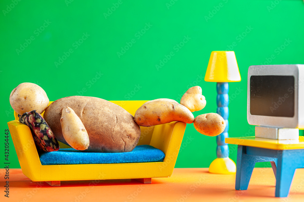 A quirky metaphorical concept image showing a potato man lying on a ...