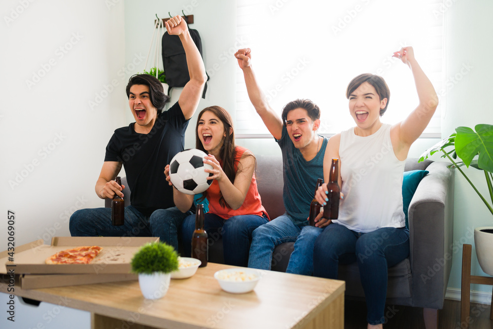 Excited friends rooting for their team Stock Photo | Adobe Stock