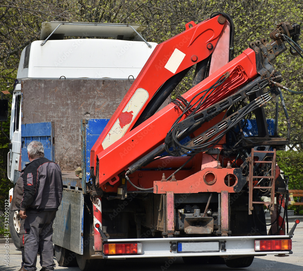 Mobile crane on the rear side of a truck Stock Photo | Adobe Stock