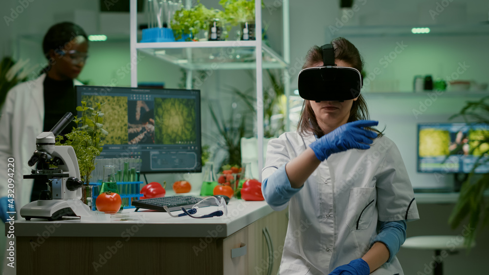 Scientist woman researcher wearing virtual reality headset developing ...