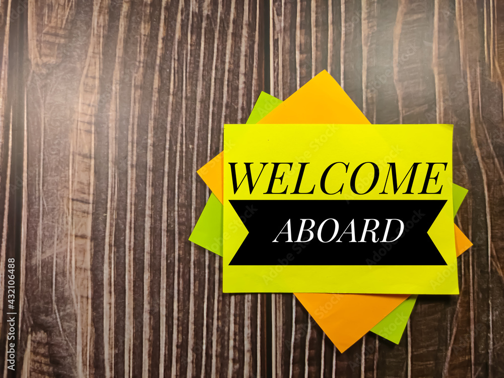 Text WELCOME ABOARD, the phrase is written on multi-colored stickers ...