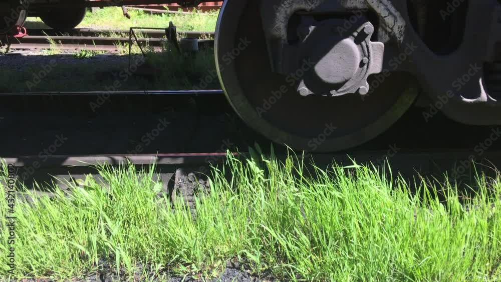 Close-up of the wheels on the rails of the railway. The wheel pairs of ...