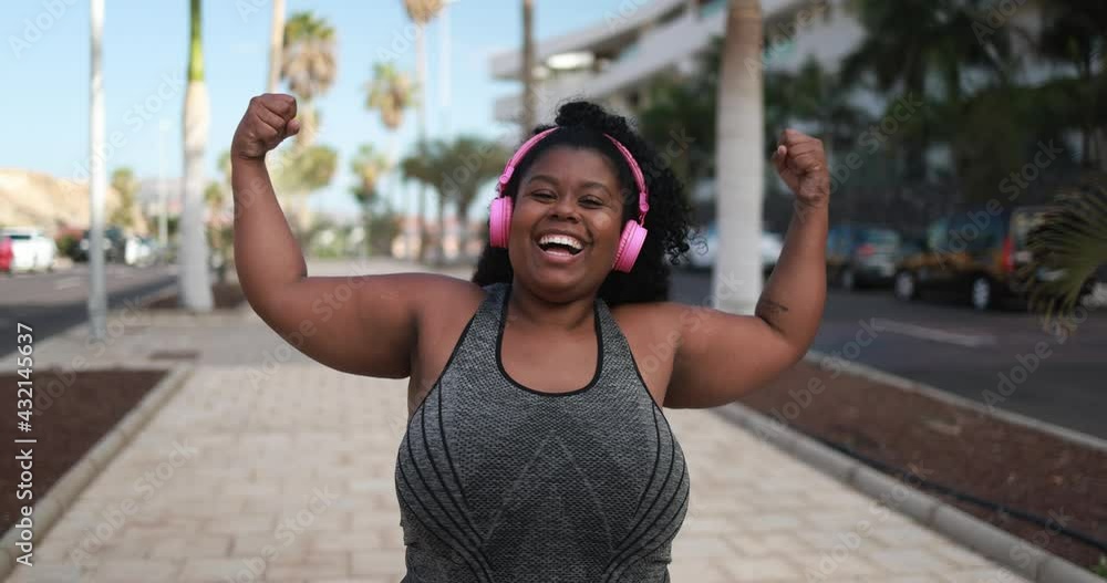 Plus Size African Girl In The City Posing Showing Biceps Muscles