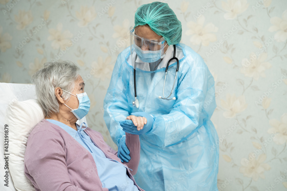 Asian doctor wearing face shield and PPE suit new normal to check ...