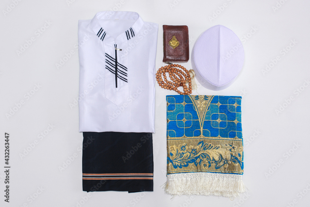 Flat lay of Muslim traditional dress and accessories for praying with ...