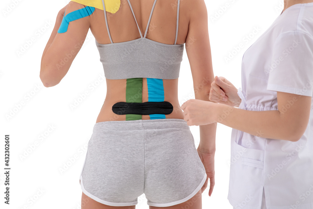 dynamic functional bandage with kinesio taping on the female back Stock ...