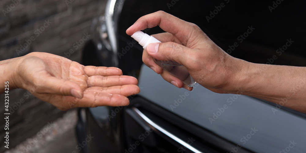 Man spraying Isopropyl alcohol (Ethanol or ethyl alcohol) liquid to ...