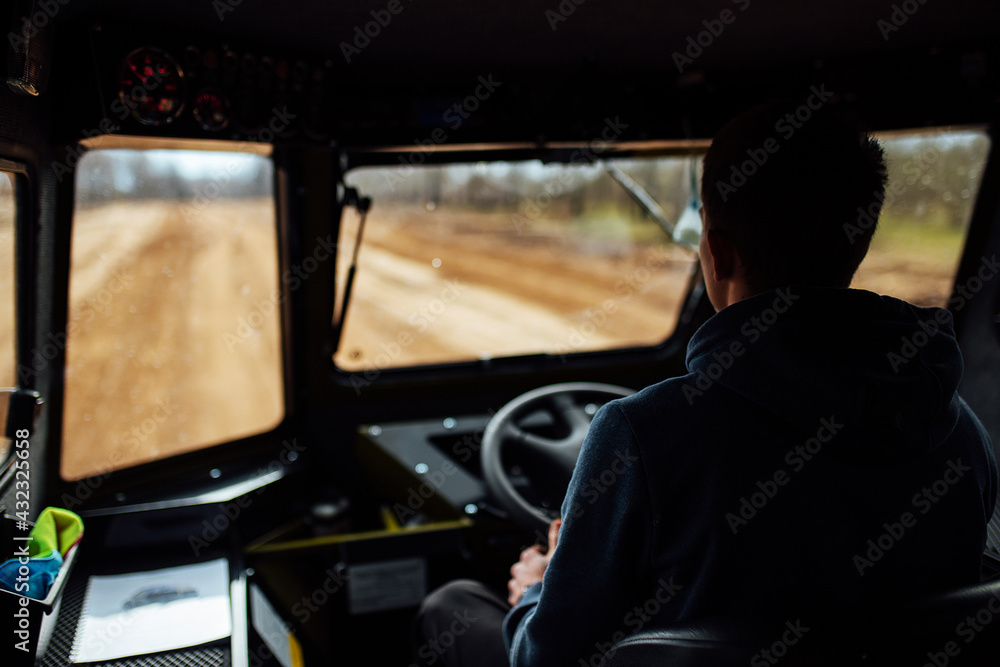 view from the interior of the SUV on the off-road. travel through the ...