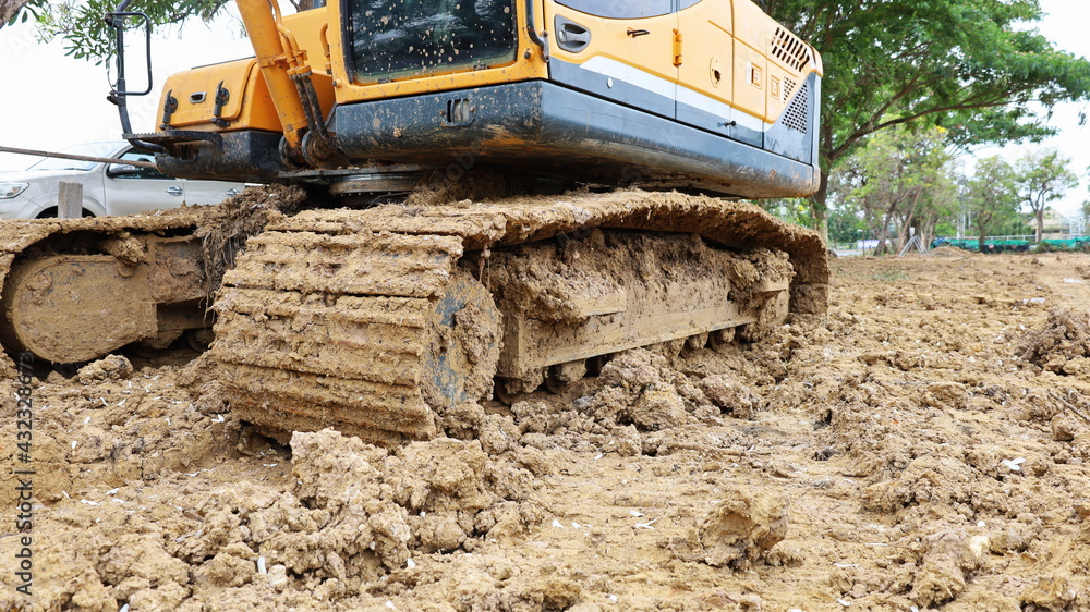 Crawler car backhoe. Metal tracks or iron tracks dirty dry soil of ...