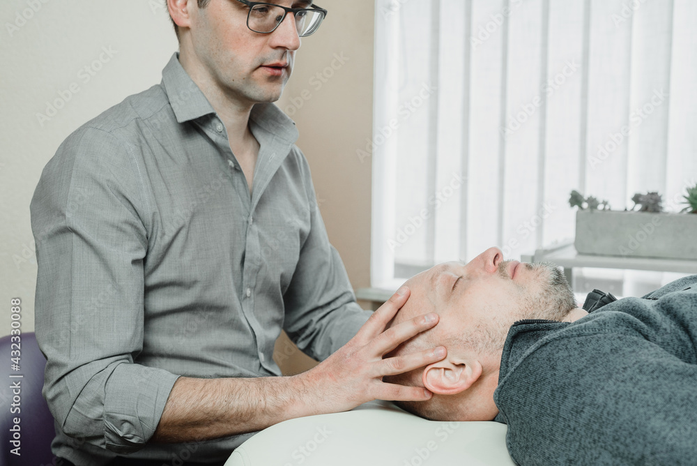 Ostheopatic treatment of a patient using CST gentle hands-on technique ...