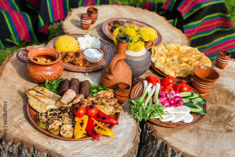 Homemade Romanian Food with grilled meat, polenta and vegetables ...