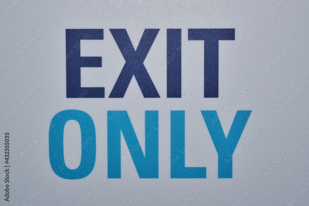 Exit Only sign, blue capital English lettering on white background ...