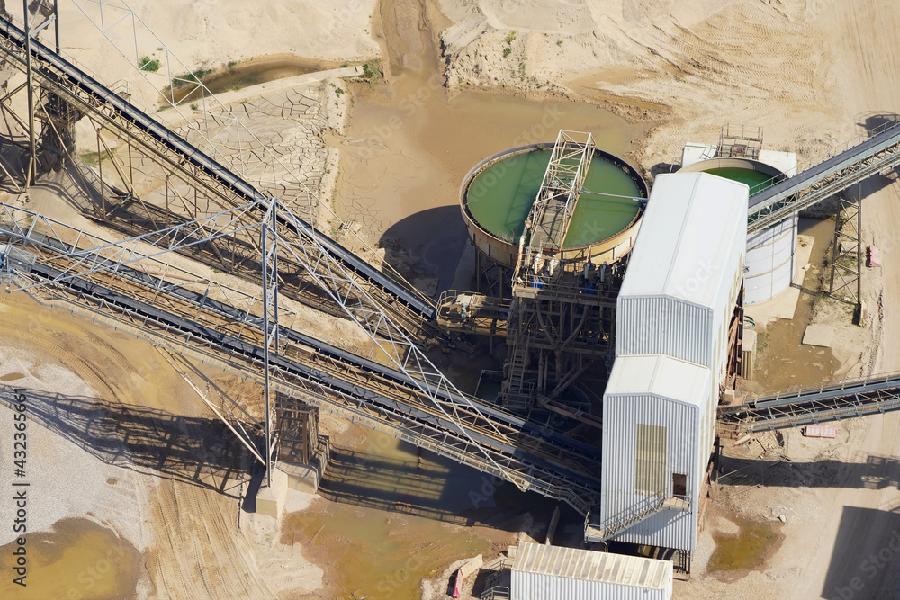 An aerial view taken from a helicopter of a sand and aggregate quarry ...