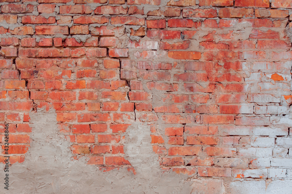 Red brick wall with cracks and breaks. Old brickwork with traces of ...