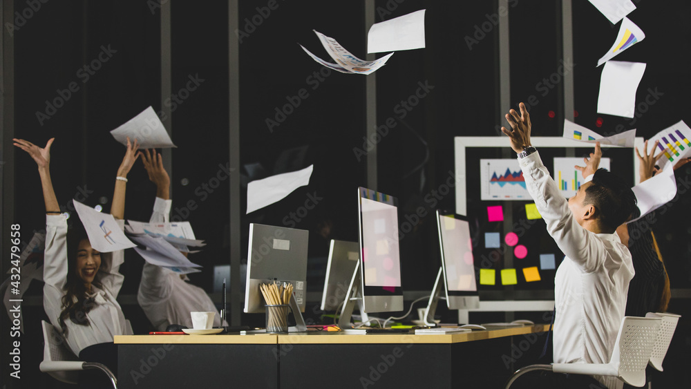 Group of four young adult Asian professional office workers celebrating ...