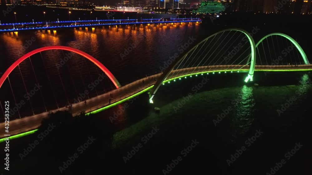 Aerial tilt view on the footbridge and the road bridge in the modern ...