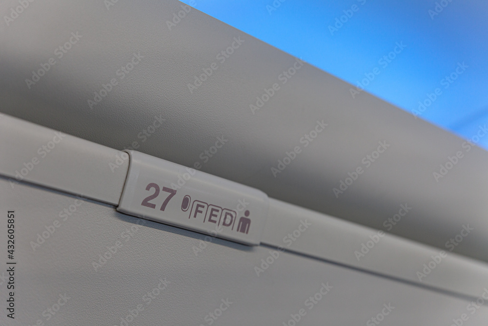 Sign of seat number with number and letter on luggage shell inside ...