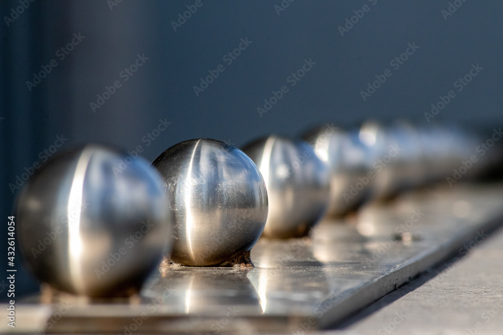 Matt steel balls in a row as decorative and ornamental balustrade and ...