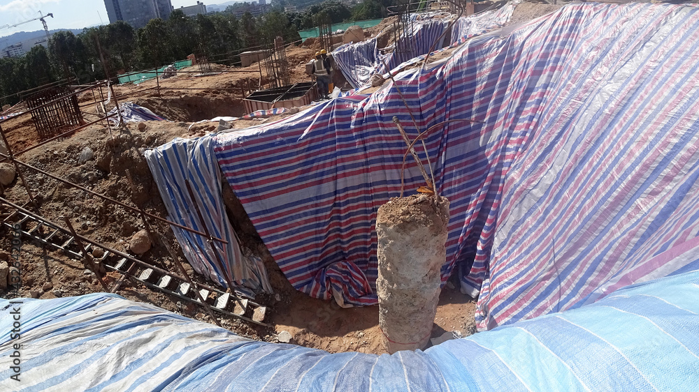 SEREMBAN, MALAYSIA -MARCH 05, 2021: Construction workers cutting ...
