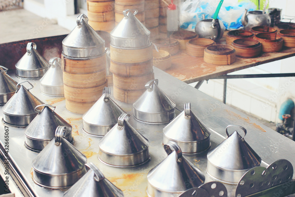 Group of dim sum are steaming on the stove Chinese restaurant that is ...