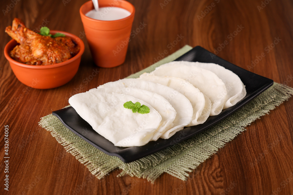 Rice Pathiri , pathir flat bread with spicy chicken curry, coconut milk ...