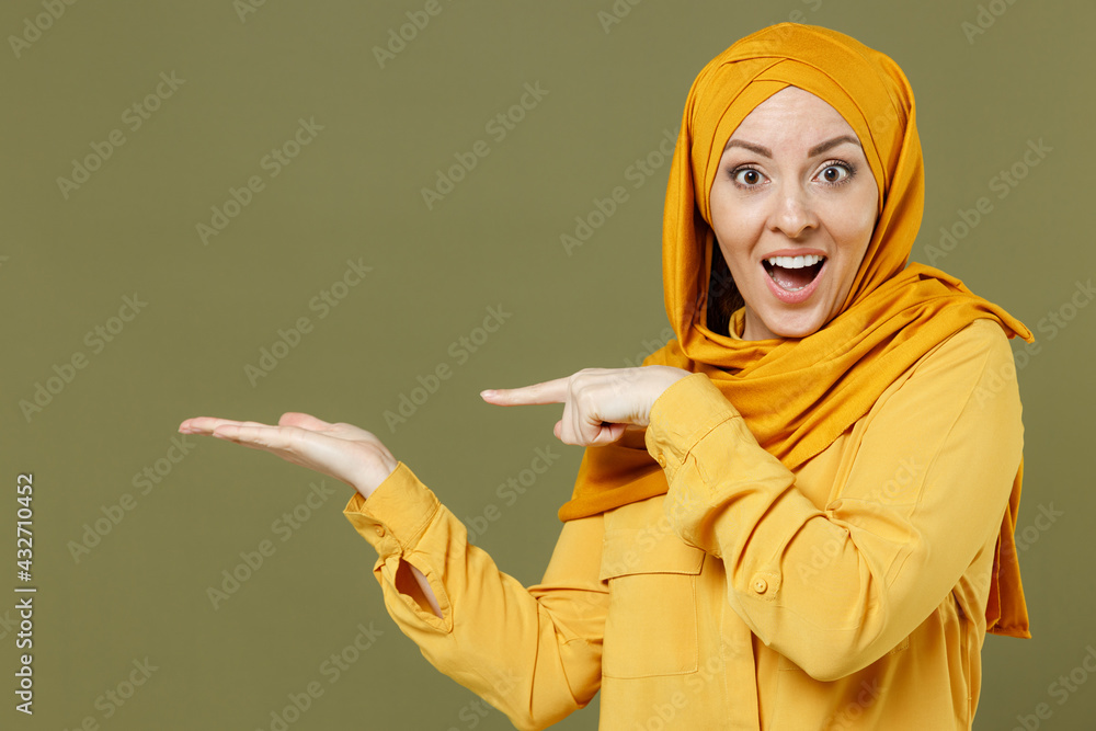 Young arabian asian muslim woman in abaya hijab yellow clothes point ...