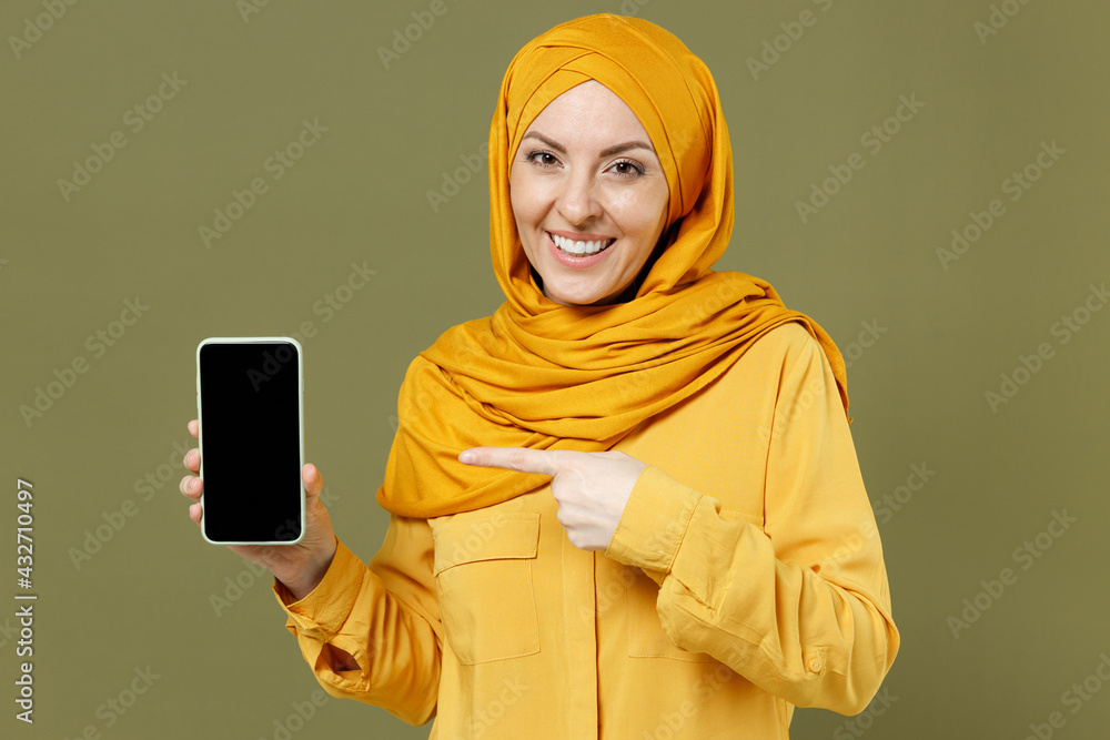 Young arabian asian muslim woman in abaya hijab yellow clothes point ...