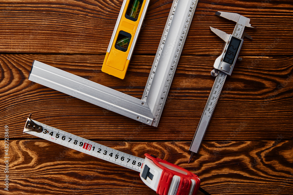 Electronic vernier caliper, wooden background Stock Photo | Adobe Stock
