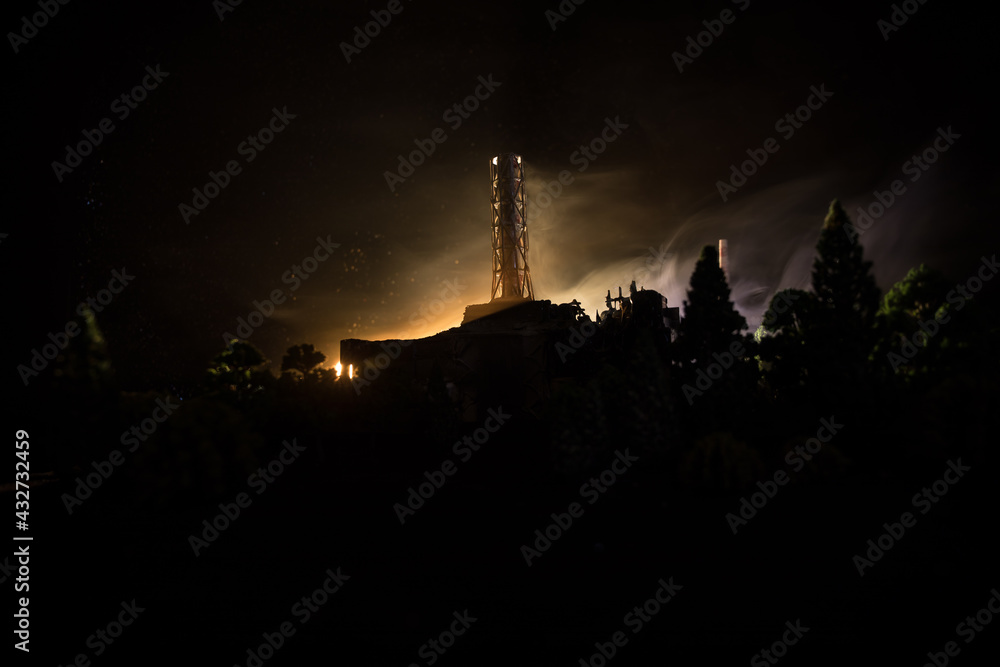 Creative artwork decoration. Chernobyl nuclear power plant at night ...