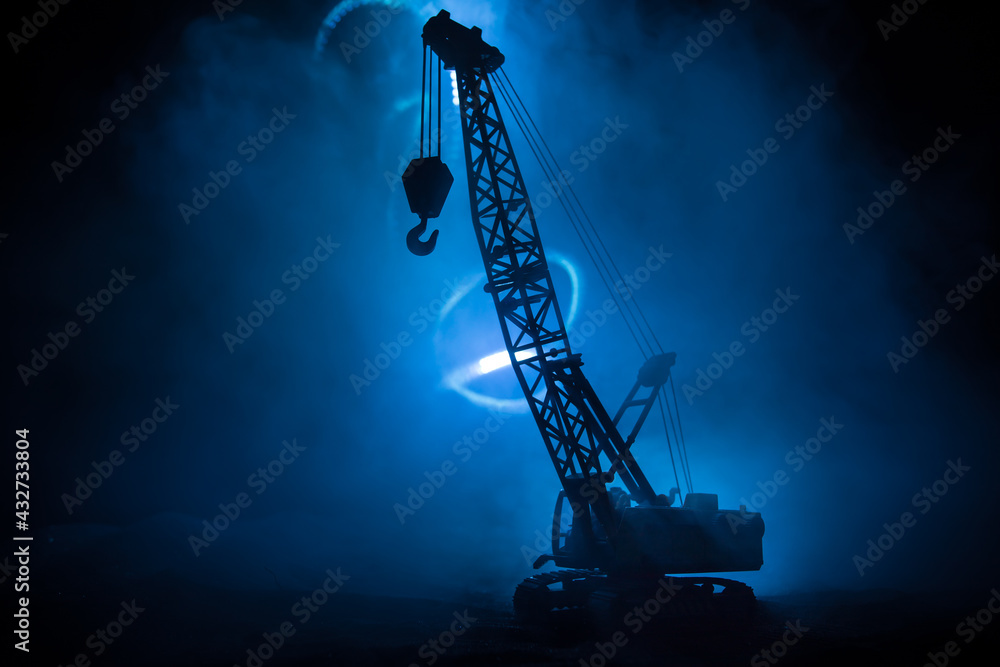 Abstract Industrial background with construction crane silhouette over ...