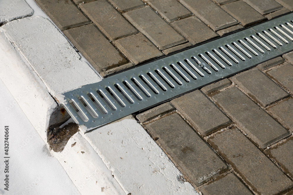 Iron grate of a drainage system for storm water drainage from a ...