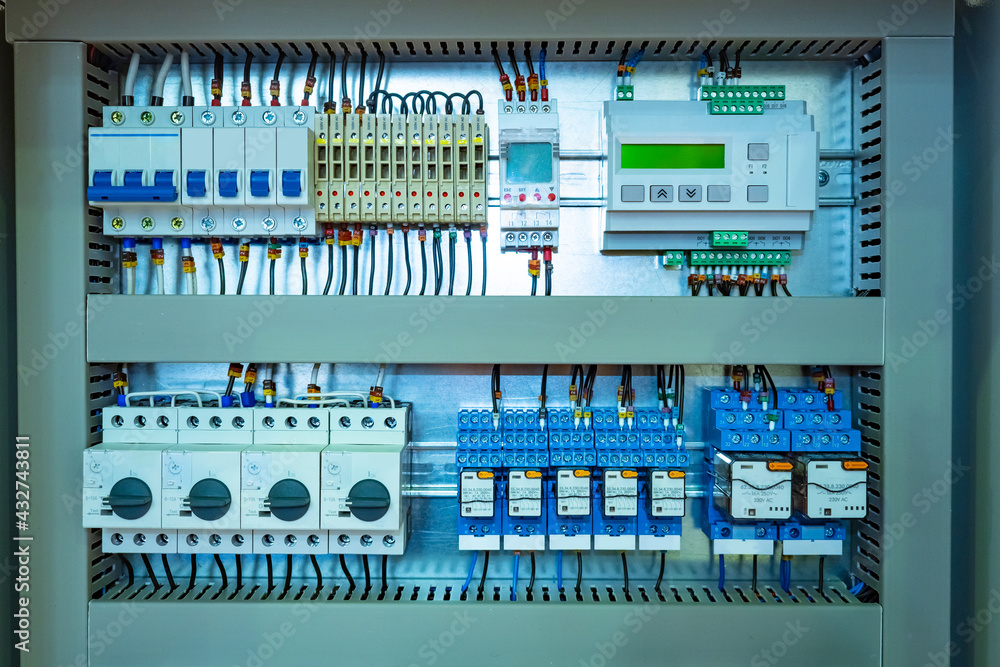 Electrical distribution cabinet with many automatic devices. Metal ...