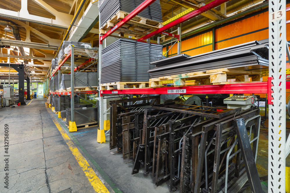 Factory warehouse steel reinforcement. High stacked shelving. Stock ...