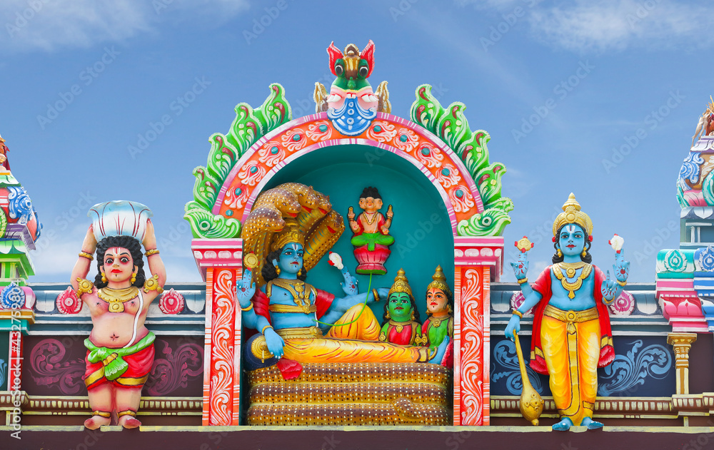 Hindu god Vishnu statue on temple tower Stock Photo | Adobe Stock