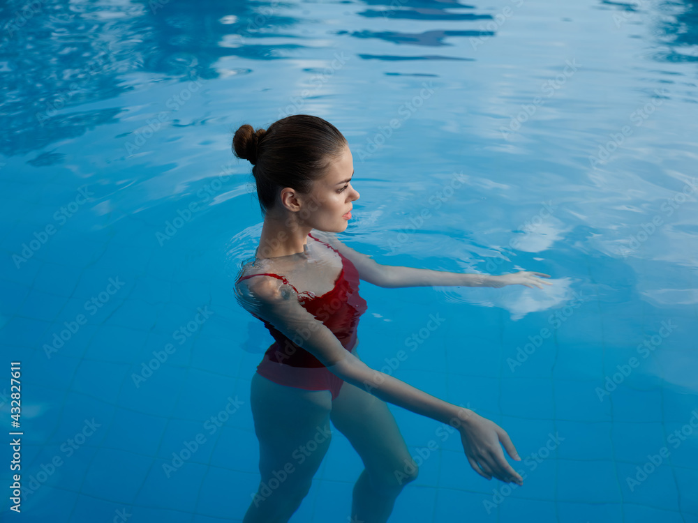 woman Swimming in the pool in a swimsuit transparent water model ...