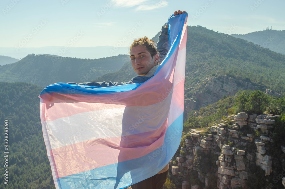 Transgender Man Looking at Camera in Bullfighter Pose with Big LGTB ...