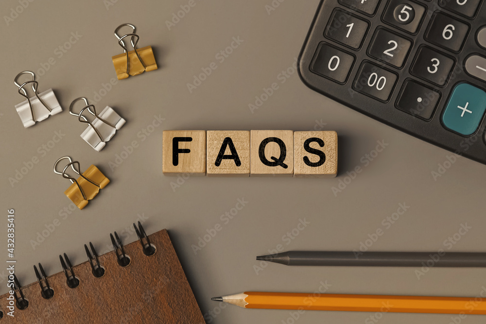 Word - FAQS frequently asked questions - on small wooden blocks on the ...