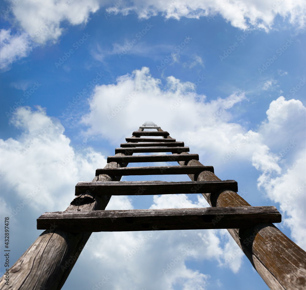 Wooden ladder leading high up in the heavenly looking blue sky and ...