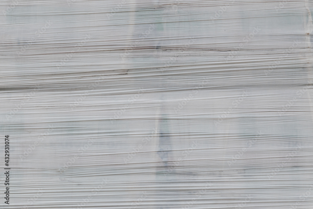 white shrink wrap film with horizontal folds - full frame background ...