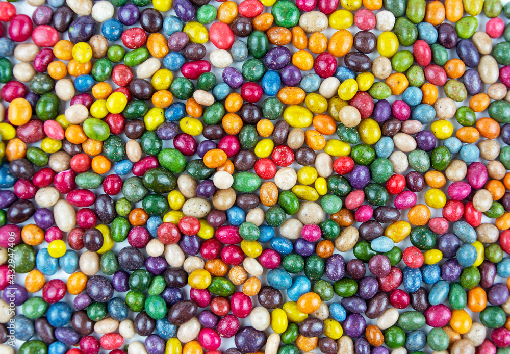 Colorful background of colorful round candy drops. Assorted bright ...